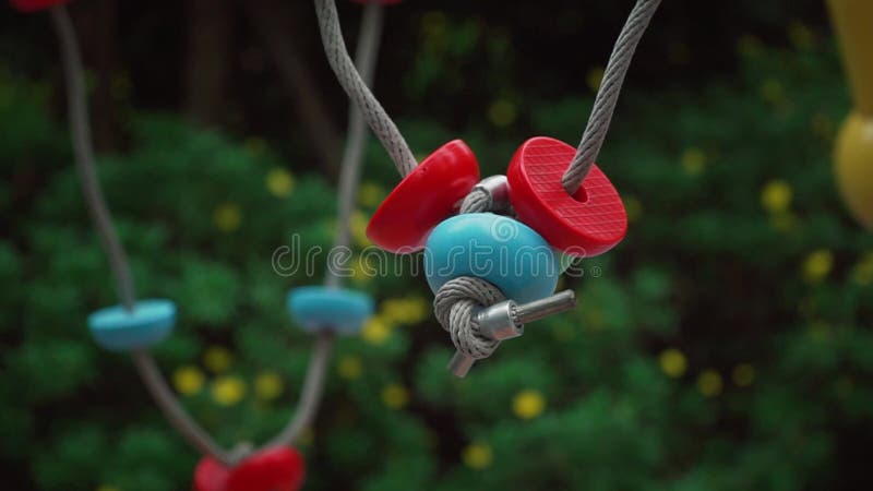 Close-up View of Plastic Objects Tied on a Rope in a Garden Stock Video ...