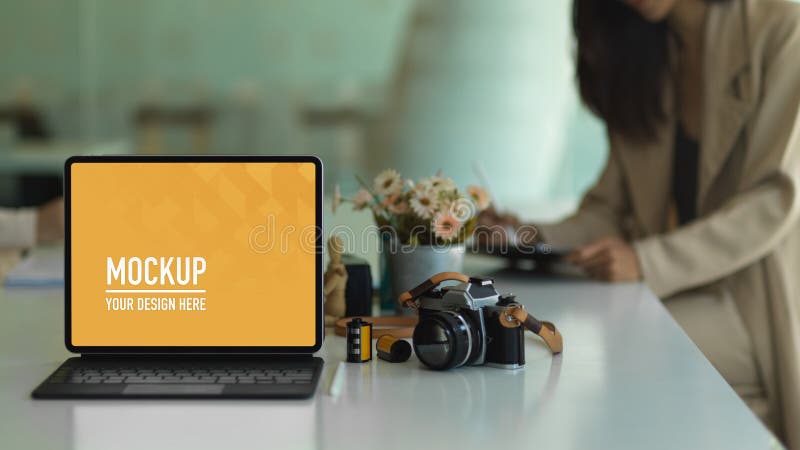 Portable Workspace with Tablet, Camera and Accessories on the Table ...