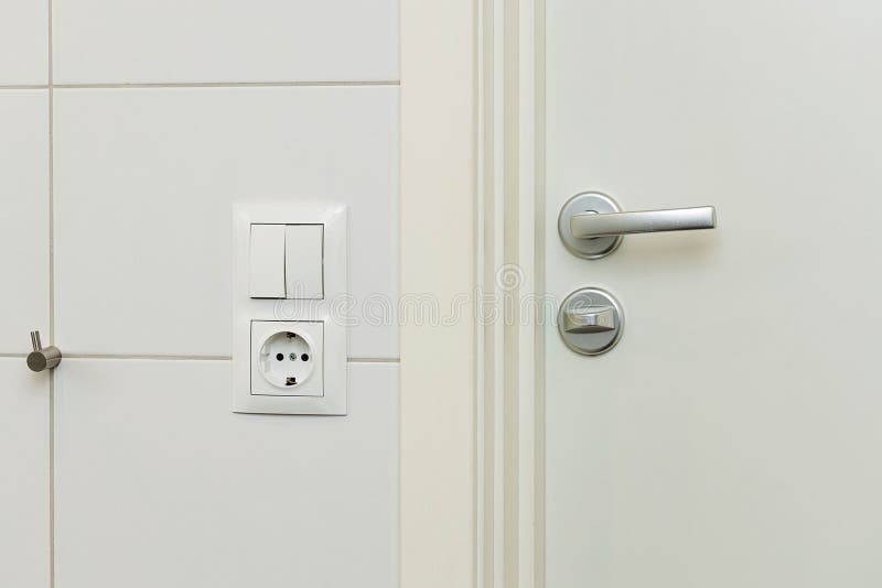 Close Up View of Power Socket and Power Switch Near Door Handle on ...