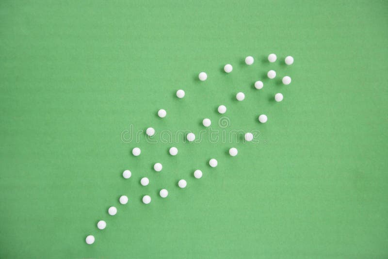 Close-up View of Push Pins Forming Leaf Over Colored Background Stock ...