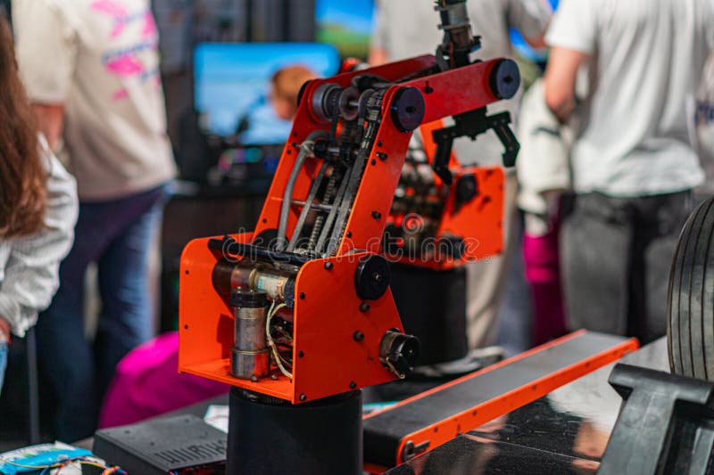 A Close-up View of a Red and Black Robotic Arm with Multiple Joints ...
