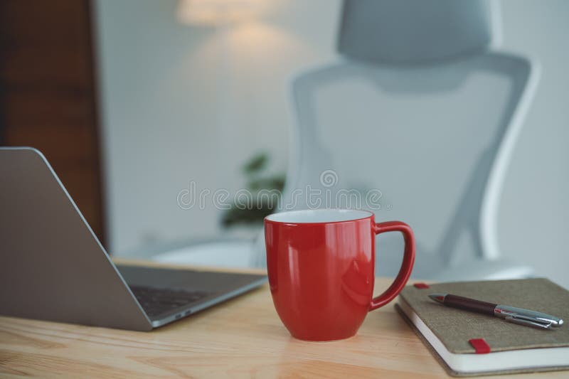 Close Up View of Red Cup of Coffee in Worktable Workpalce with Laptop ...