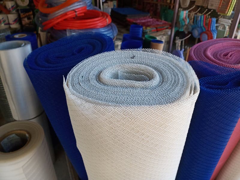 Rolled-up Light Beige Mesh Fabric Material. Stock Photo - Image of ...