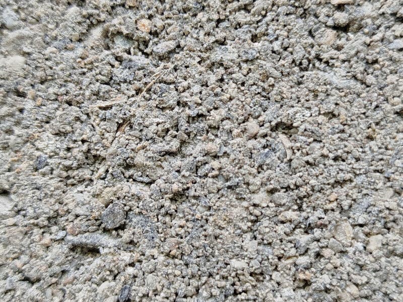 A Close-up View of a Rough, Textured Concrete Surface—gritty, Raw, and ...