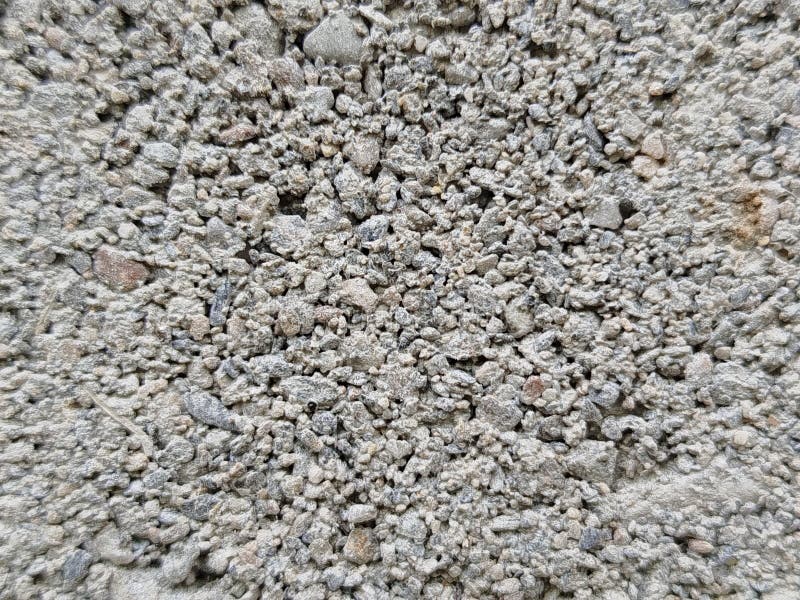 A Close-up View of a Rough, Textured Concrete Surface—gritty, Raw, and ...
