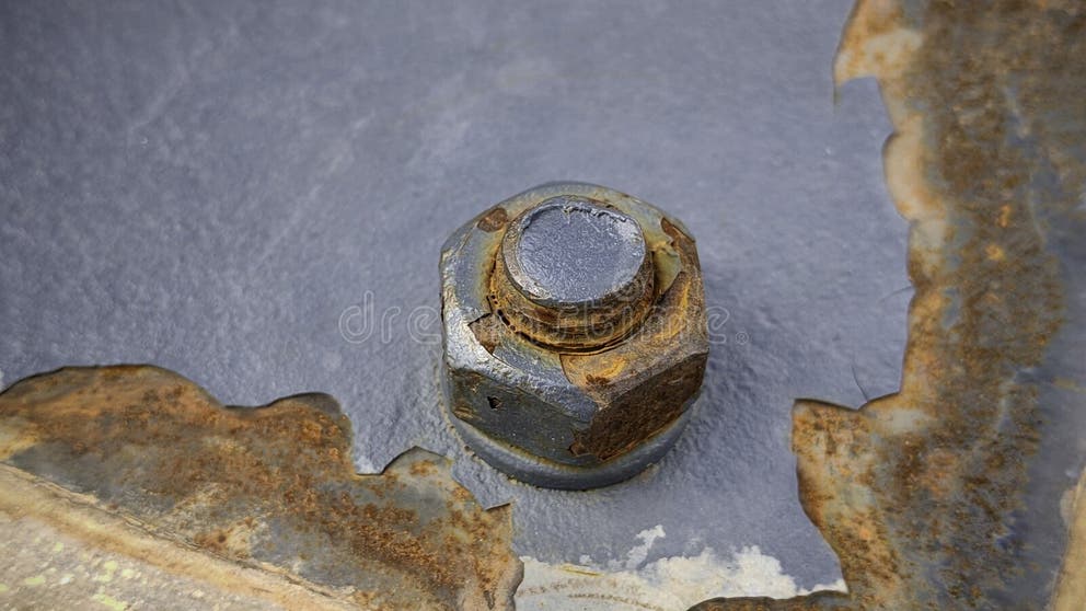 Close-Up View of a Rusty Bolt and Nut on Painted Metal Surface Stock ...