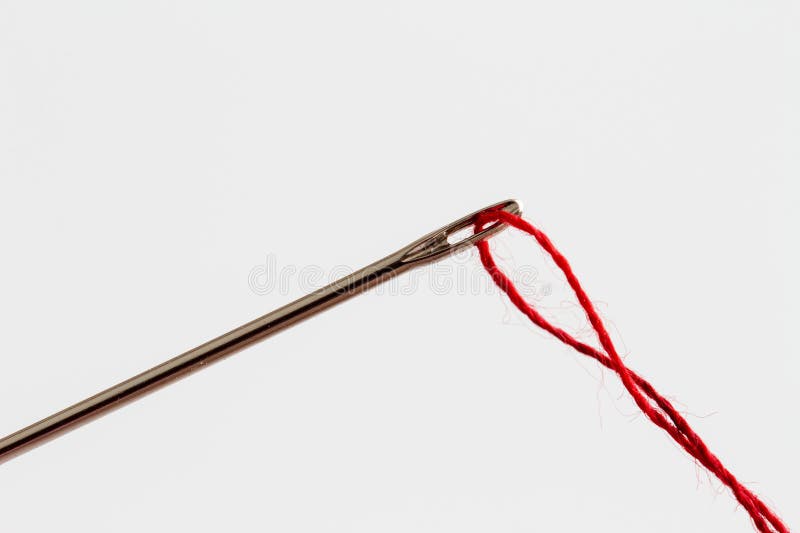 Close Up View of Sewing Needle Eye and Red Thread Stock Image - Image ...