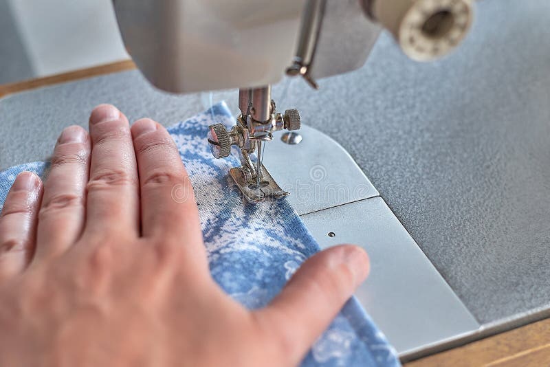Close Up View of Sewing Process. Female Hands Stitching Blue Fabric ...