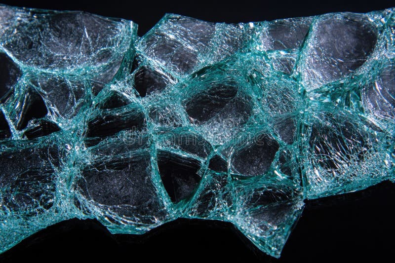 A Close-up View of Shattered Glass on a Dark Surface, Useful for ...