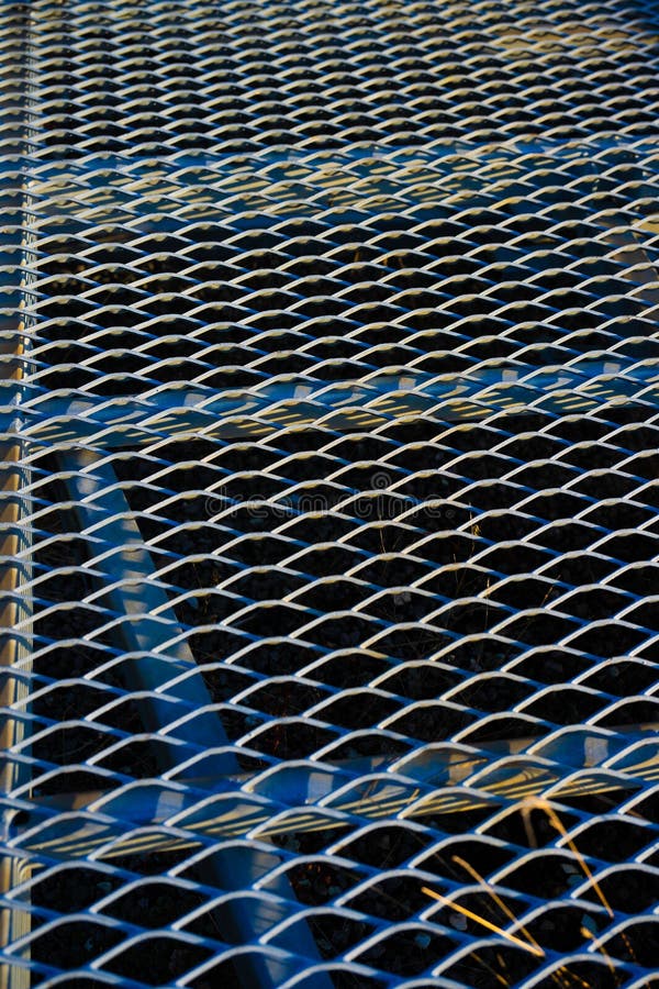 Close-up View of Silver Metal Grating with Diamond-shaped Openings ...