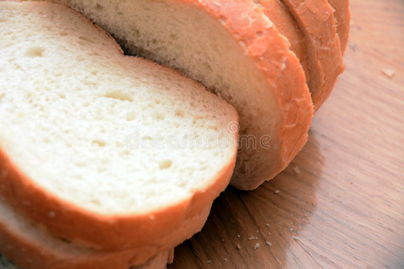 Close Up View of a Sliced Bread Placed on a Wooden Table. Stock Image ...