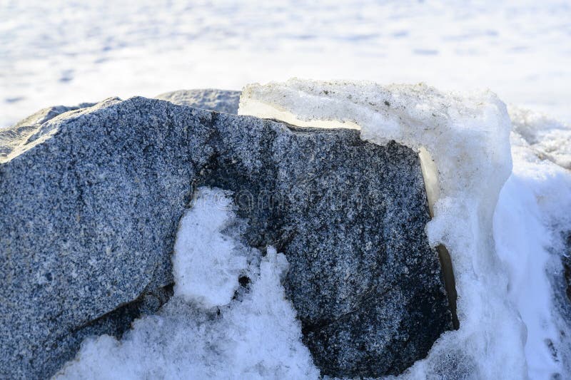 Snow Melting and Freezing on the Rock Walls Stock Image - Image of ...