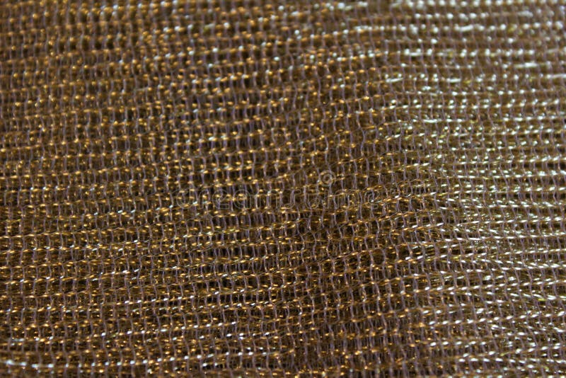 Gold colored mesh fabric stock photo. Image of elegant - 134469612