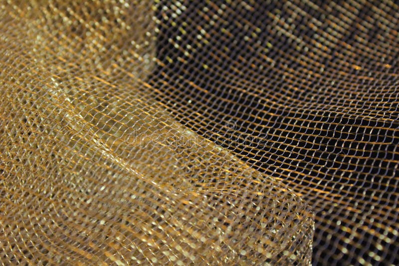 Gold colored mesh fabric stock photo. Image of colored - 134469680