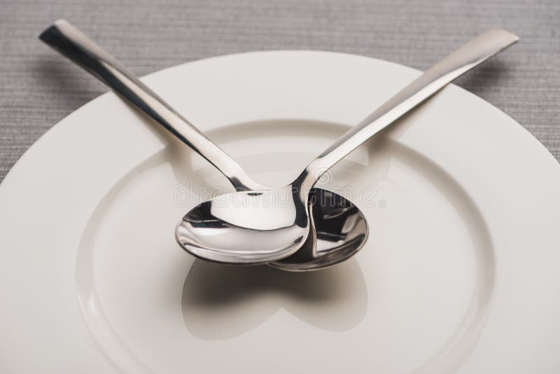Close Up View of Spoons on Plate Stock Photo - Image of tablecloth ...