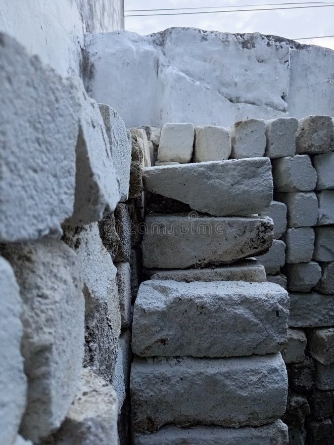 Close-up View of Stacked White Limestone Bricks in a Narrow Alley Stock ...