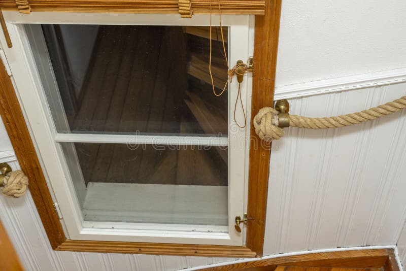 Close Up View of Stair Window with Brown Frame and Nautical Rope ...