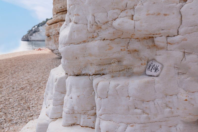 Close-up View of Stone with Sign on the Beach Stock Image - Image of ...