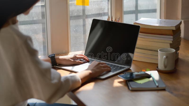 Close-up View of Student Taking Notes on Her Exam while Typing Laptop ...