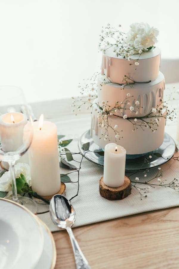 Close Up View of Stylish Table Setting with Candles and Wedding Cake ...