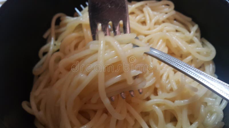 Close Up View of Swirling Noodles or Spaghetti Pasta in a Bowl Stock ...