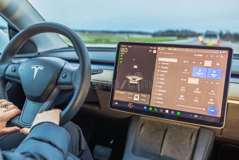 Close Up View of Tesla Model Y Interior with Driver Using Touchscreen ...