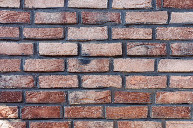 Textured Brick Wall with a Mix of Red and Brown Tones in Urban Setting ...