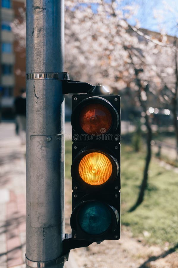 A Close Up View of a Traffic Light with a Blurry Background Stock Image ...
