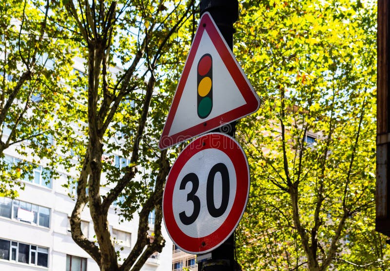 Close Up View of Traffic Signs with Trees Stock Photo - Image of speed ...