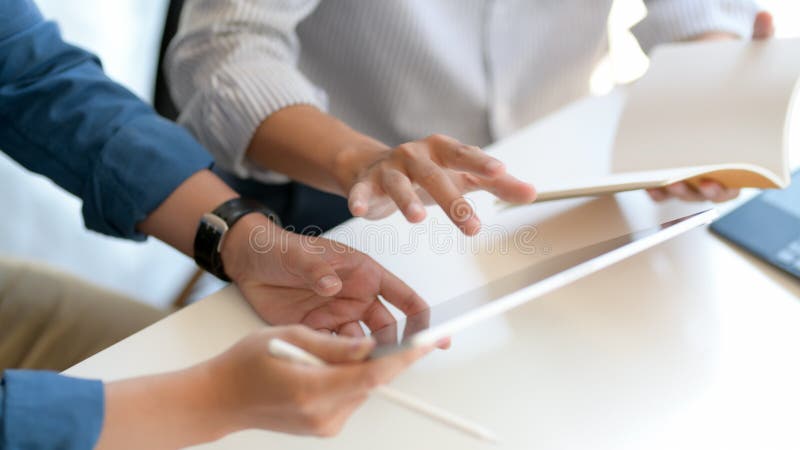 Close Up View of Two Businesspeople Consulting on Their Work on White ...