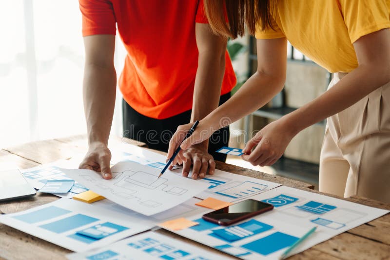 UI Developer Team Brainstorming on Their Project with Laptop ...
