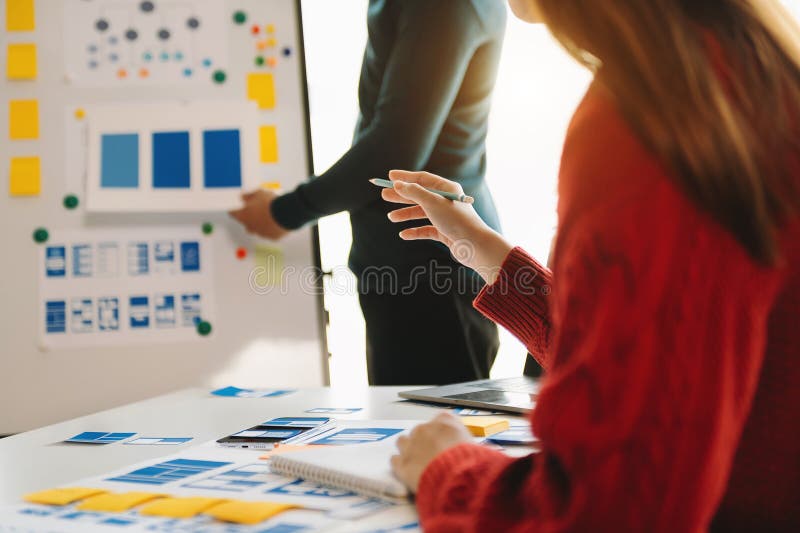 UI Developer Team Brainstorming on Their Project with Laptop ...