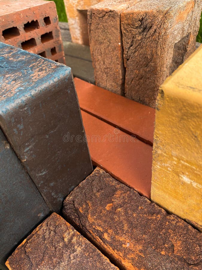 Different Types of Bricks Stacked Beautifully on Green Grass Stock ...