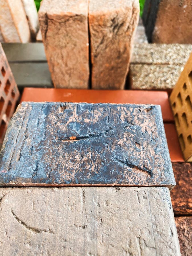 Different Types of Bricks Stacked Beautifully on Green Grass Stock ...