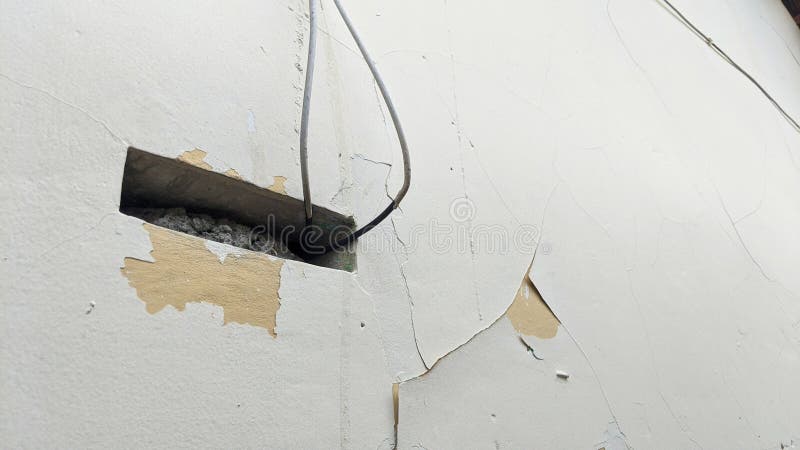 A Close-up View of a Wall with a Rectangular Hole. the Hole is Filled ...