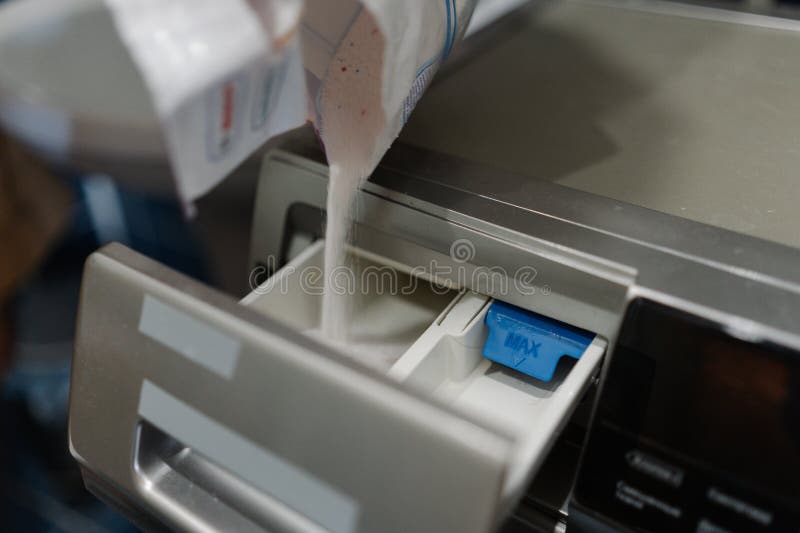 Close-up View of Washing Powder Pouring into Detergent Drawer of ...
