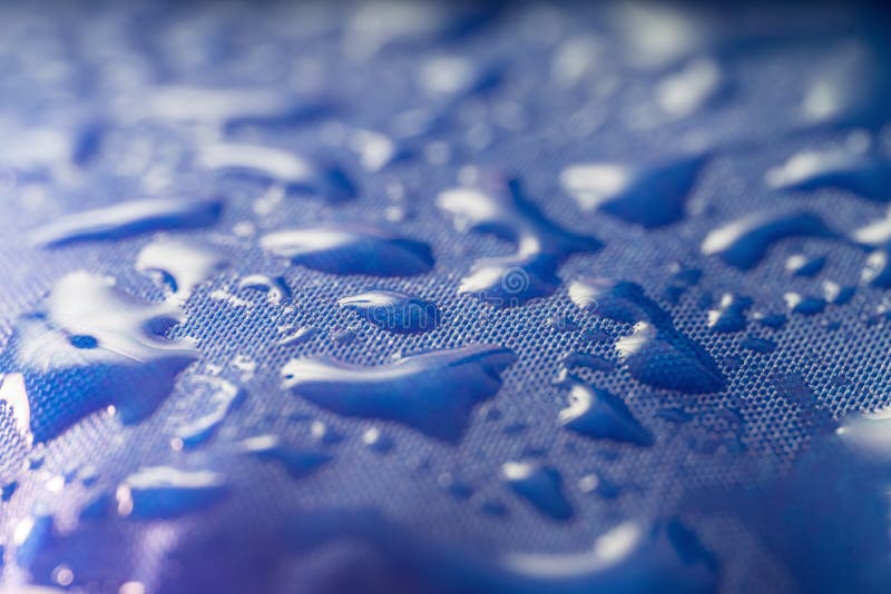 Close-up View on Water Drops on Blue Waterproof Impregnated Textile ...