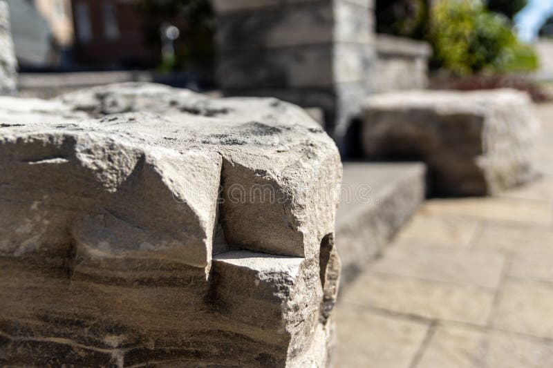 Close-up View - Weathered Stone Bench with Intricate Textures - Blurred ...