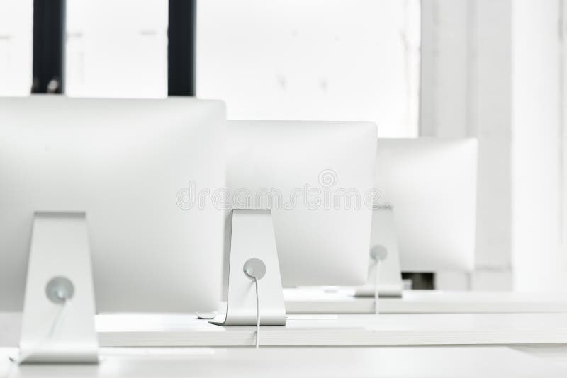 Close Up View of White Computer Monitors Standing on Tables Stock Image ...