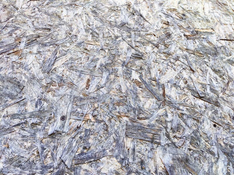 A Close-up View of a White and Gray Oriented Strand Board. Background ...