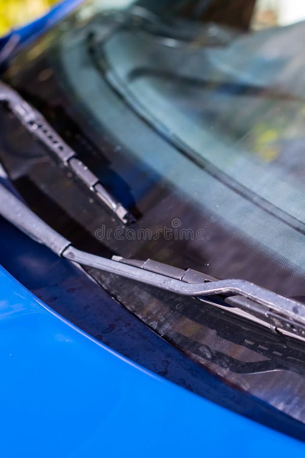 This is a Close Up View of a Windshield Wiper on a Blue Car Stock Photo ...