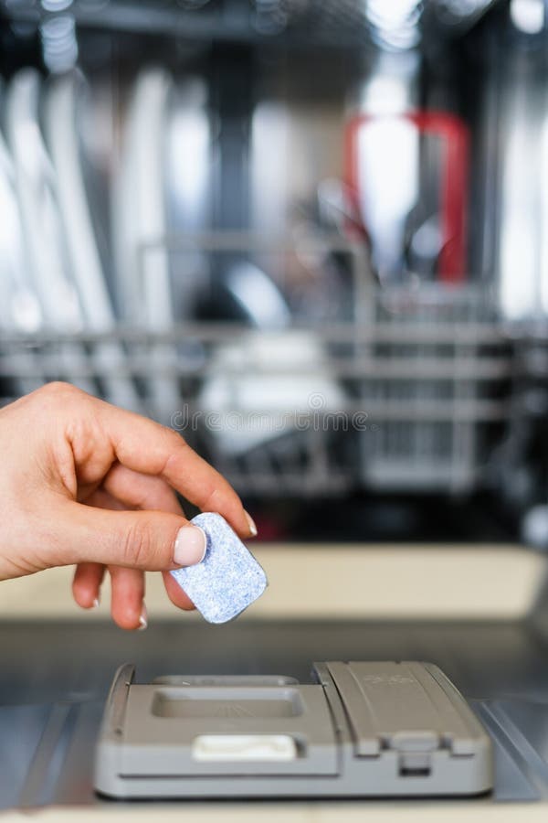 Close Up View of Woman Put Solid Detergent into Dishwashing Machine ...