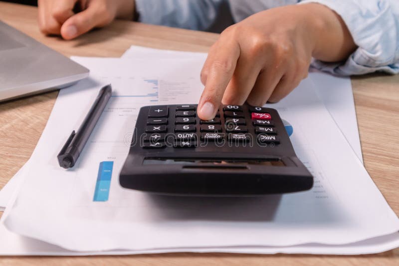 Close Up View of a Woman Using a Calculator at Her Desk Stock Image ...