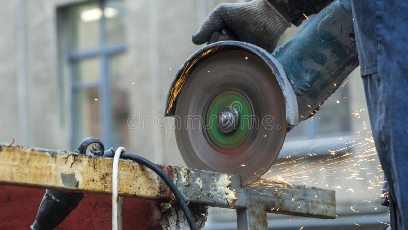 Close-up View of a Worker Working with Angle Grinder. Electric Wheel ...