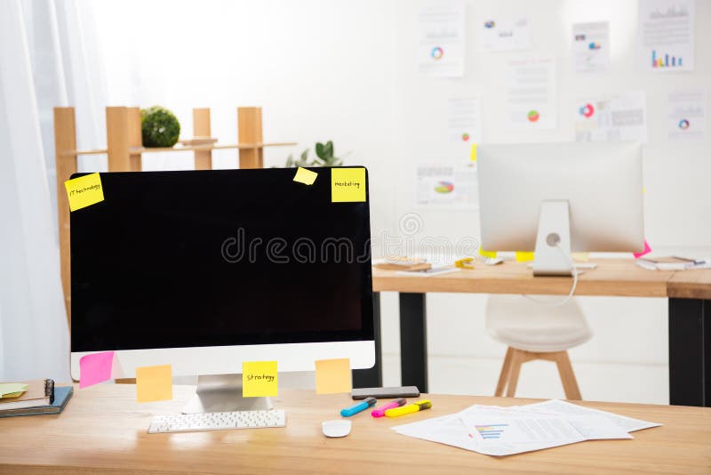 Close Up View of Workplace with Blank Computer Screen, Sticky Notes and ...