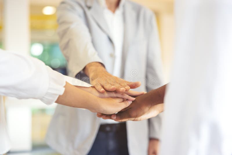 Close Up View of Young Business People Putting Their Hands Together ...
