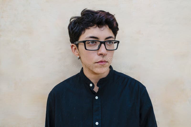 Close Up View of a Young Transgender Man Looking on a Wall. Stock Photo ...