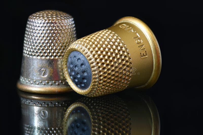 Close Up of Vintage Thimbles on Dark Glass Stock Photo - Image of ...