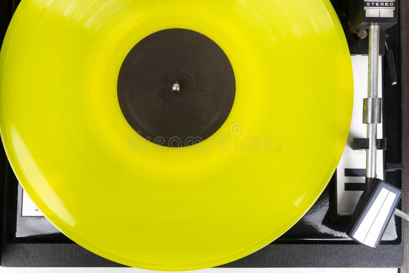 Close Up of Vintage Turntable Record Player with Yellow Vinyl Stock ...