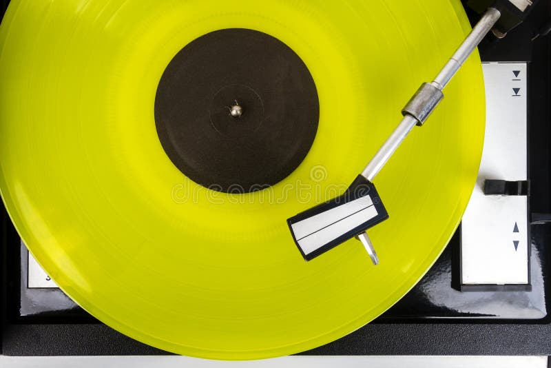 Close Up of Vintage Turntable Record Player with Yellow Vinyl Stock ...